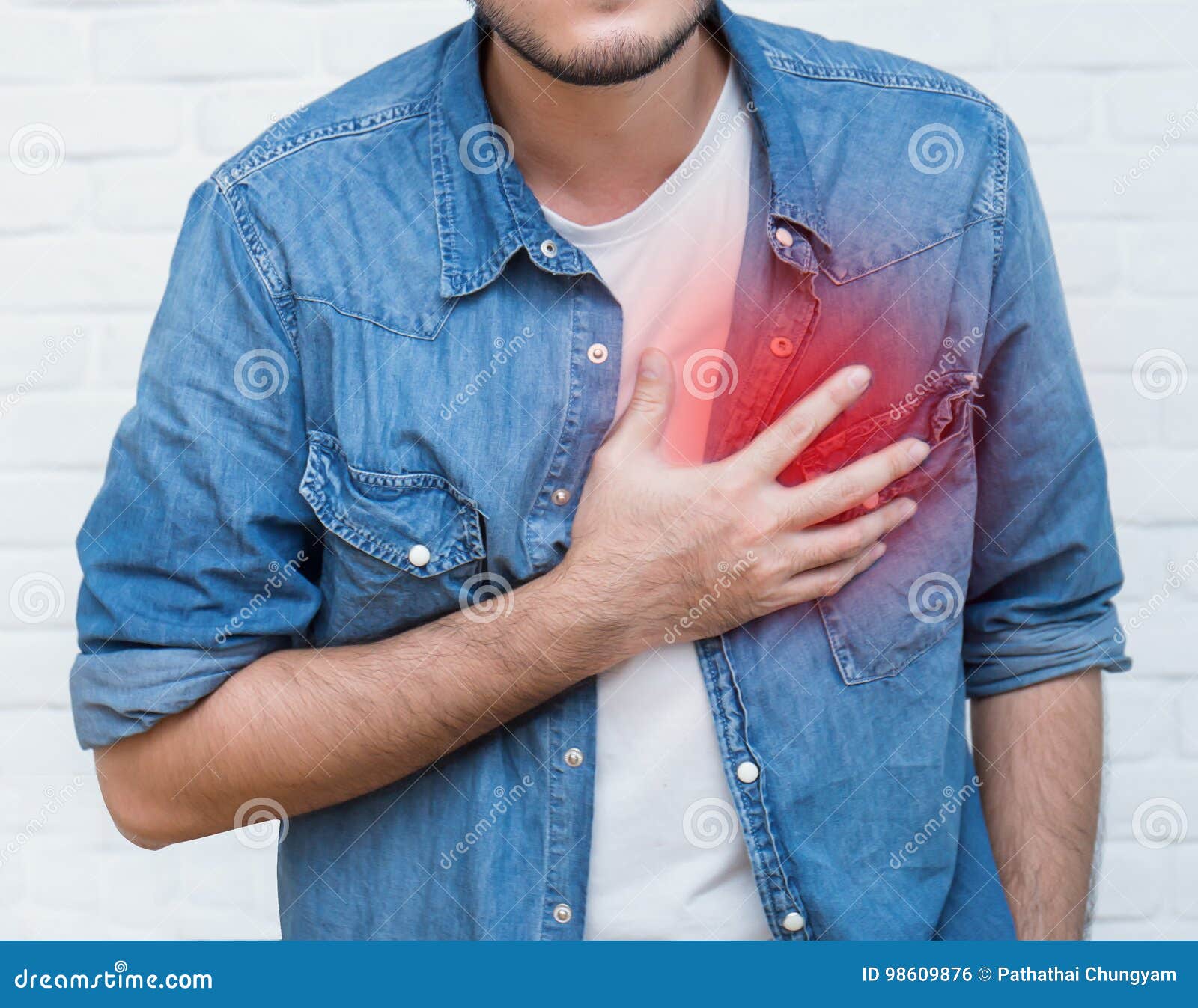 Young Man with His Hand Holding His Chest Stock Photo - Image of ...