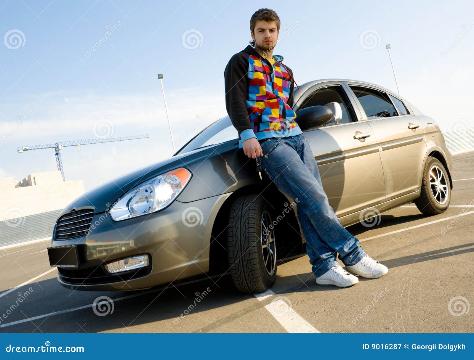 Young man with his new car stock image. Image of model - 9016287