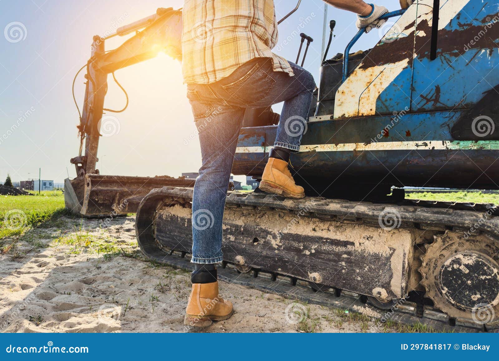 Young Man and His Old Excavator during Work on a Construction Site ...