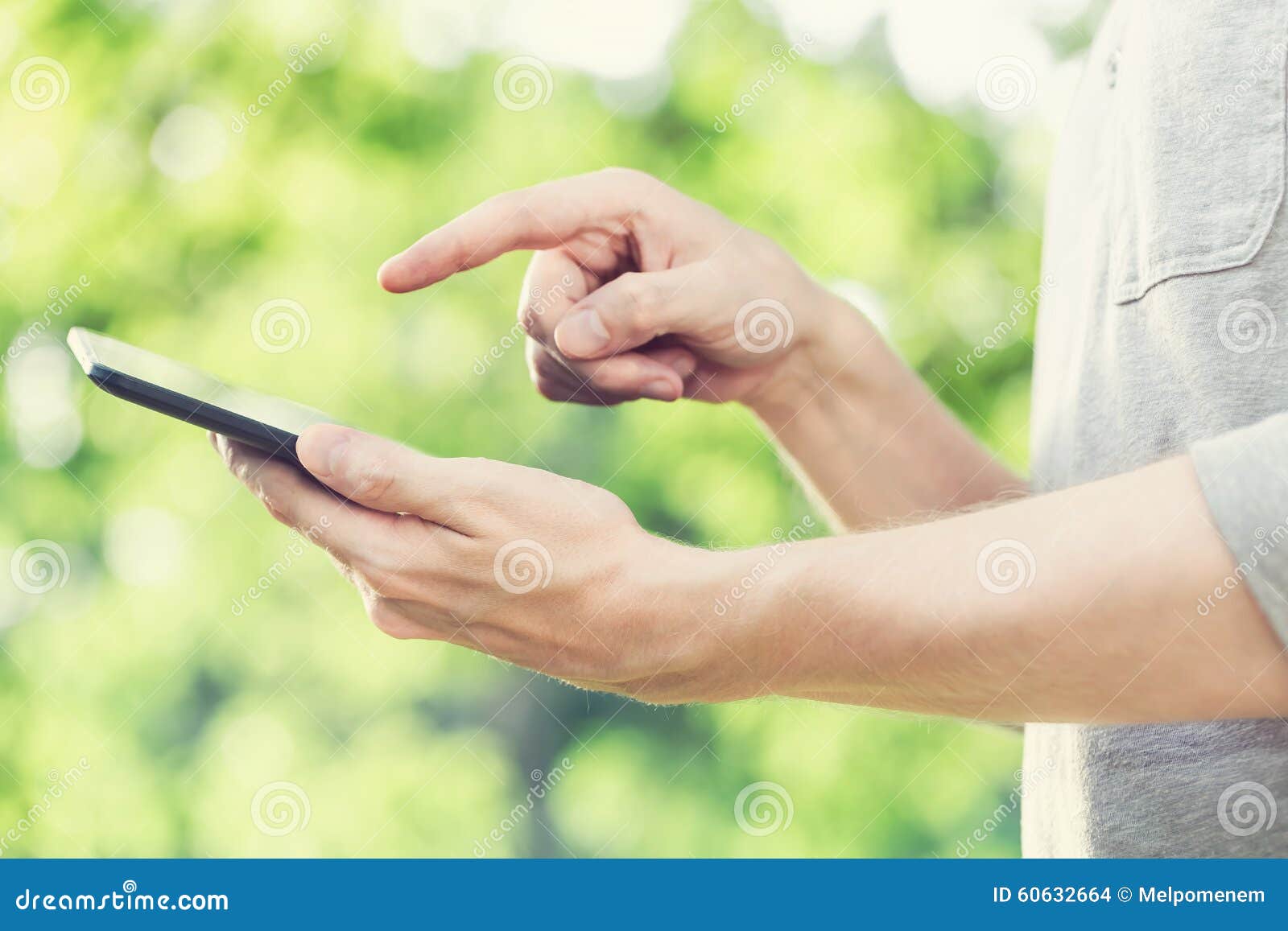 Young Man on His Smartphone Outdoors Stock Photo - Image of park ...