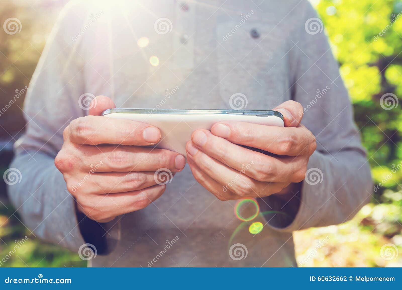 Young Man on His Smartphone Outside Stock Photo - Image of outdoors ...