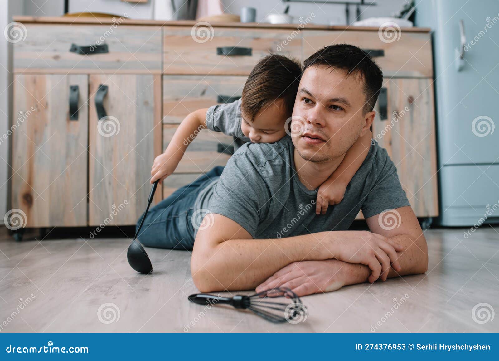Young Man and His Son with Oven Sheet in Kitchen. Father with Little Son on the Kitchen Stock ...