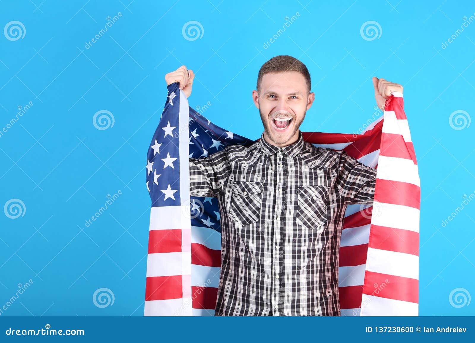 Man Holding an American Flag Stock Photo - Image of modern, male: 137230600