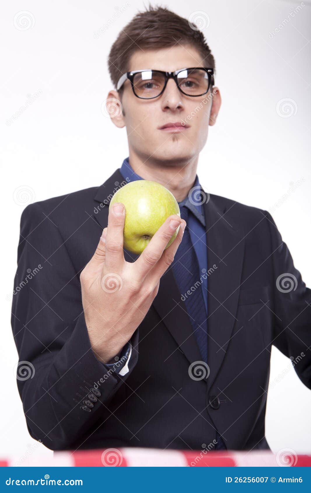 Young man holding an apple stock image. Image of apple - 26256007
