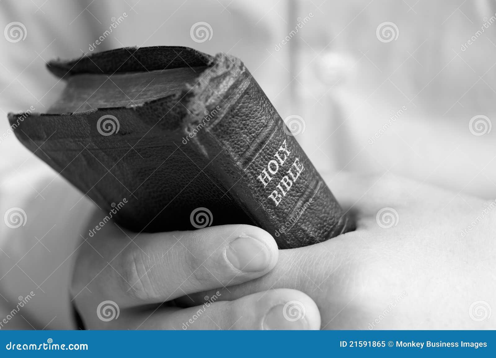 Young man holding bible stock image. Image of monochrome - 21591865