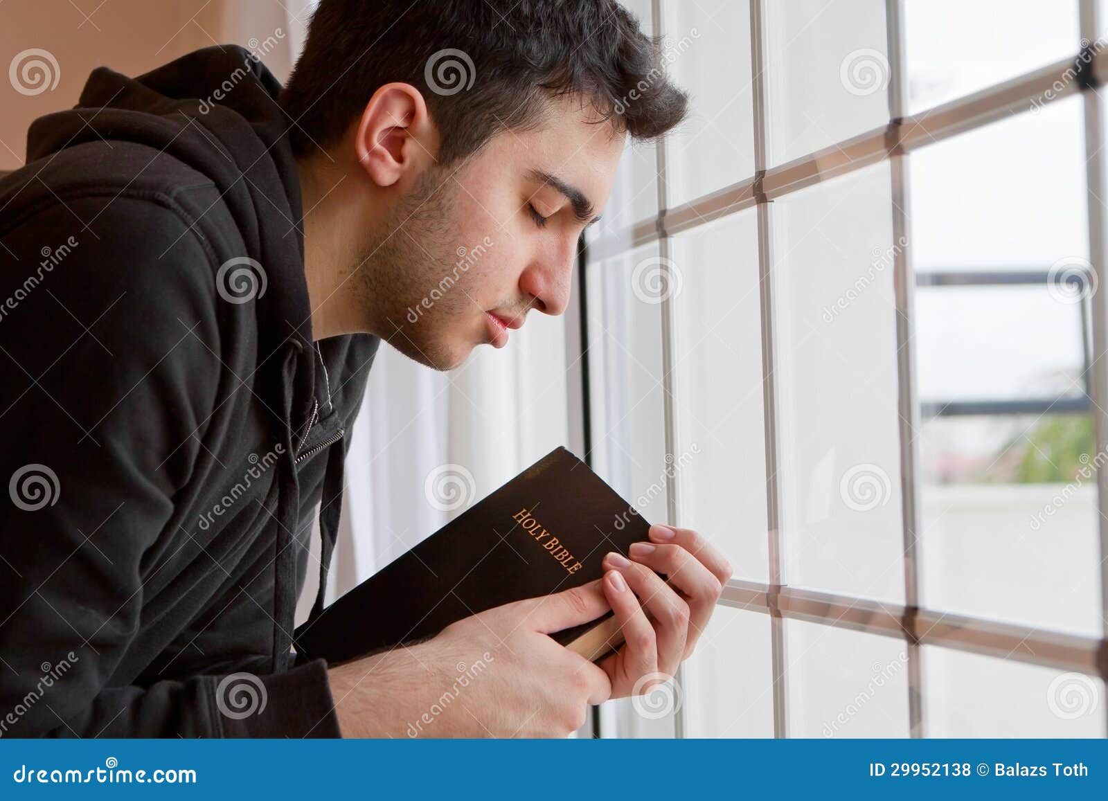 Man Praying By Window Stock Photography | CartoonDealer.com #29952374