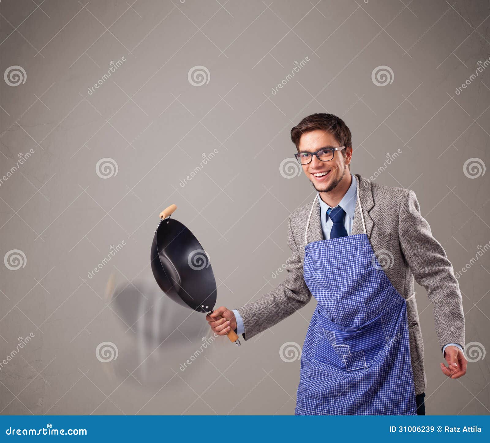 Young Man Holding a Black Frying Pan Stock Image - Image of looking ...