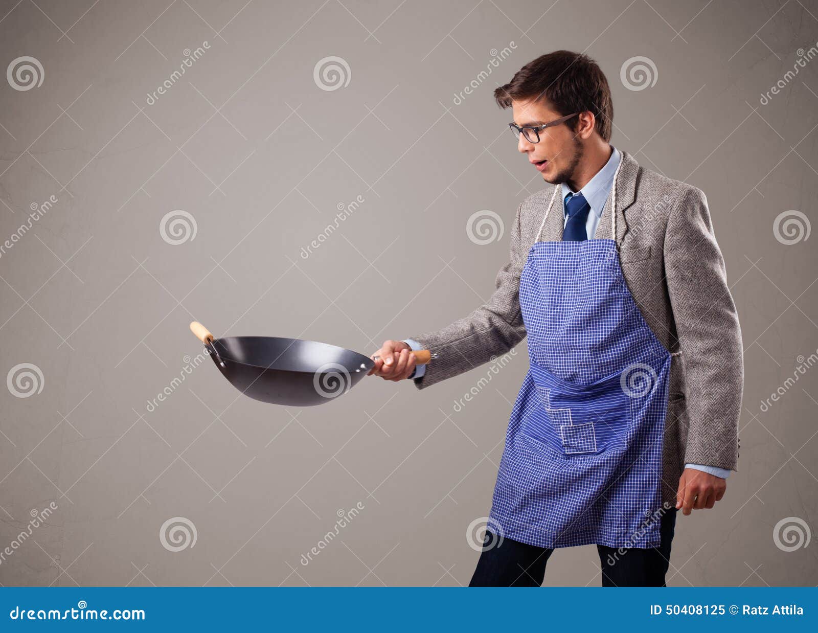 Young Man Holding a Black Frying Pan Stock Image - Image of beautiful ...