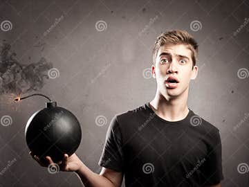 Young man holding a bomb stock photo. Image of concept - 35296948