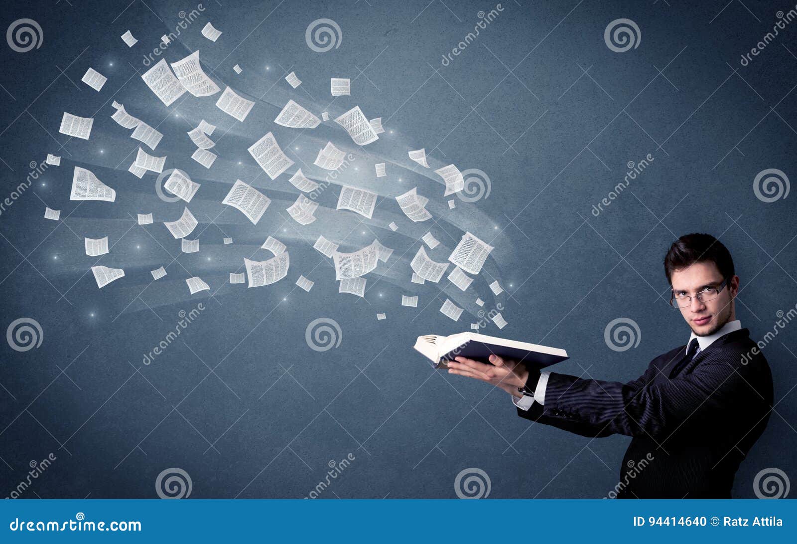 Young man holding book stock photo. Image of inspiration - 94414640