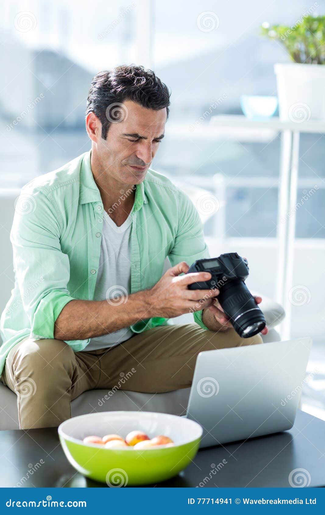 Young Man Holding Camera at Home Stock Image - Image of communication ...
