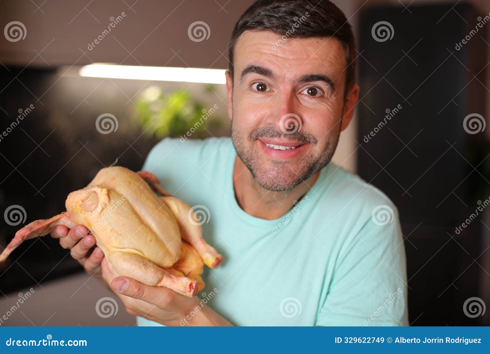 Young Man Holding a Chicken Stock Image - Image of care, chicken: 329622749