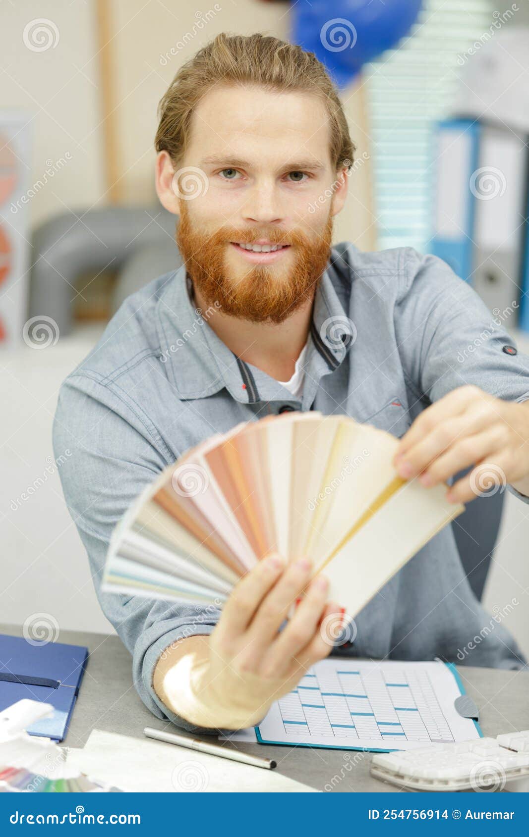 Young Man Holding Color Swatch with Painter Painting Stock Photo ...