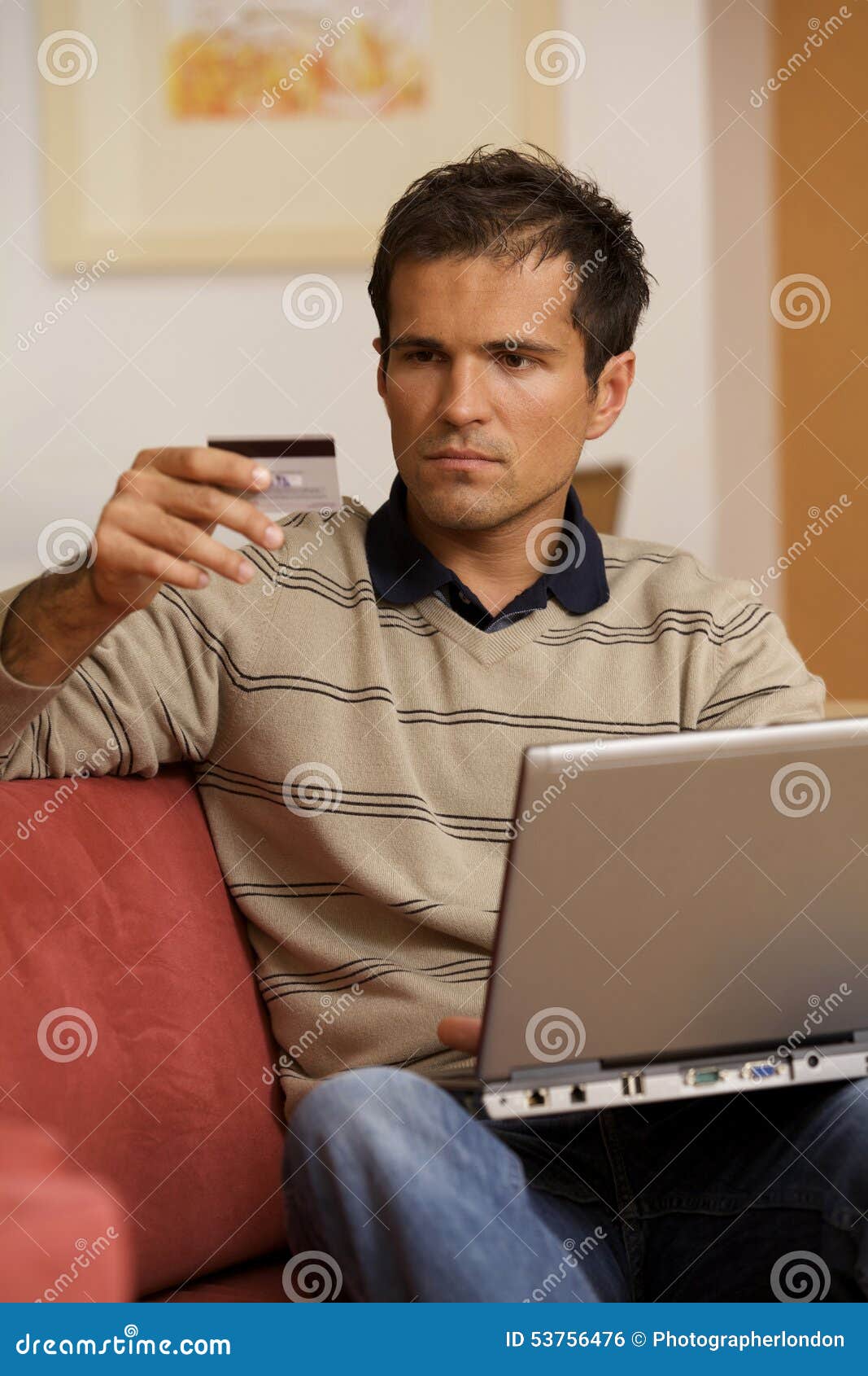 Young Man Holding Credit Card and Using Laptop Stock Photo - Image of ...