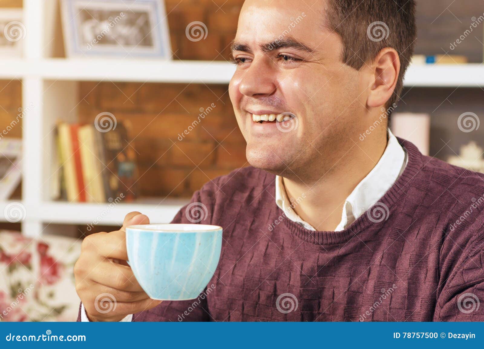 Young Man Holding a Cup in Hand and Smiling Stock Photo - Image of face ...