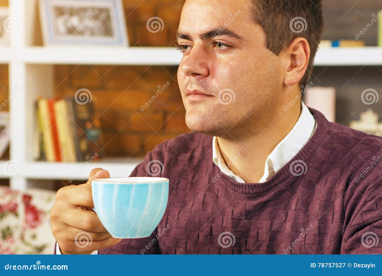 Young Man Holding a Cup in Hand and Smiling Stock Image - Image of ...