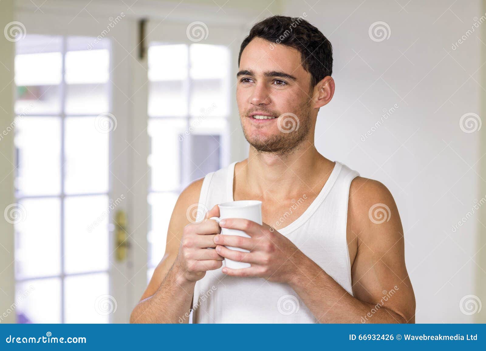 Young Man Holding a Cup of Tea Stock Photo - Image of handsome, life ...