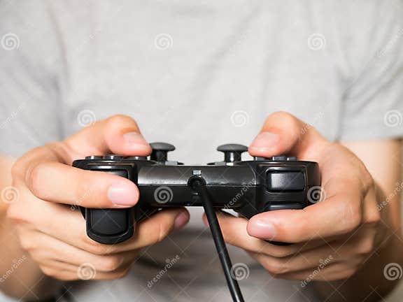 A Young Man Holding Game Controller Playing Video Games Stock Image ...