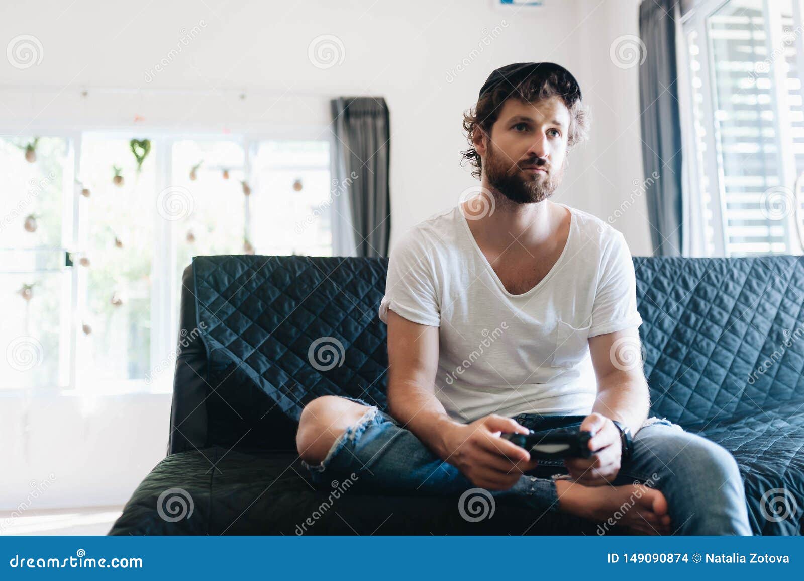 A man playing video games stock photo. Image of game - 149090874