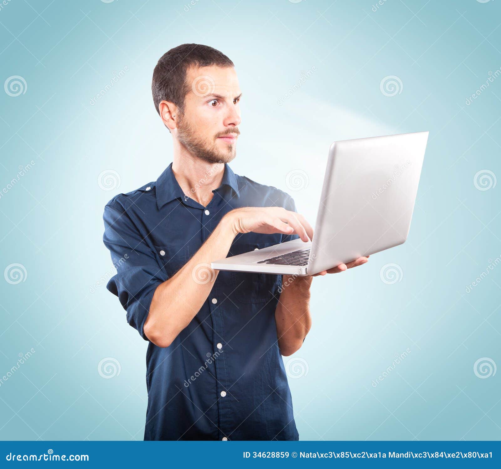 Young man holding a laptop stock image. Image of lifestyle - 34628859