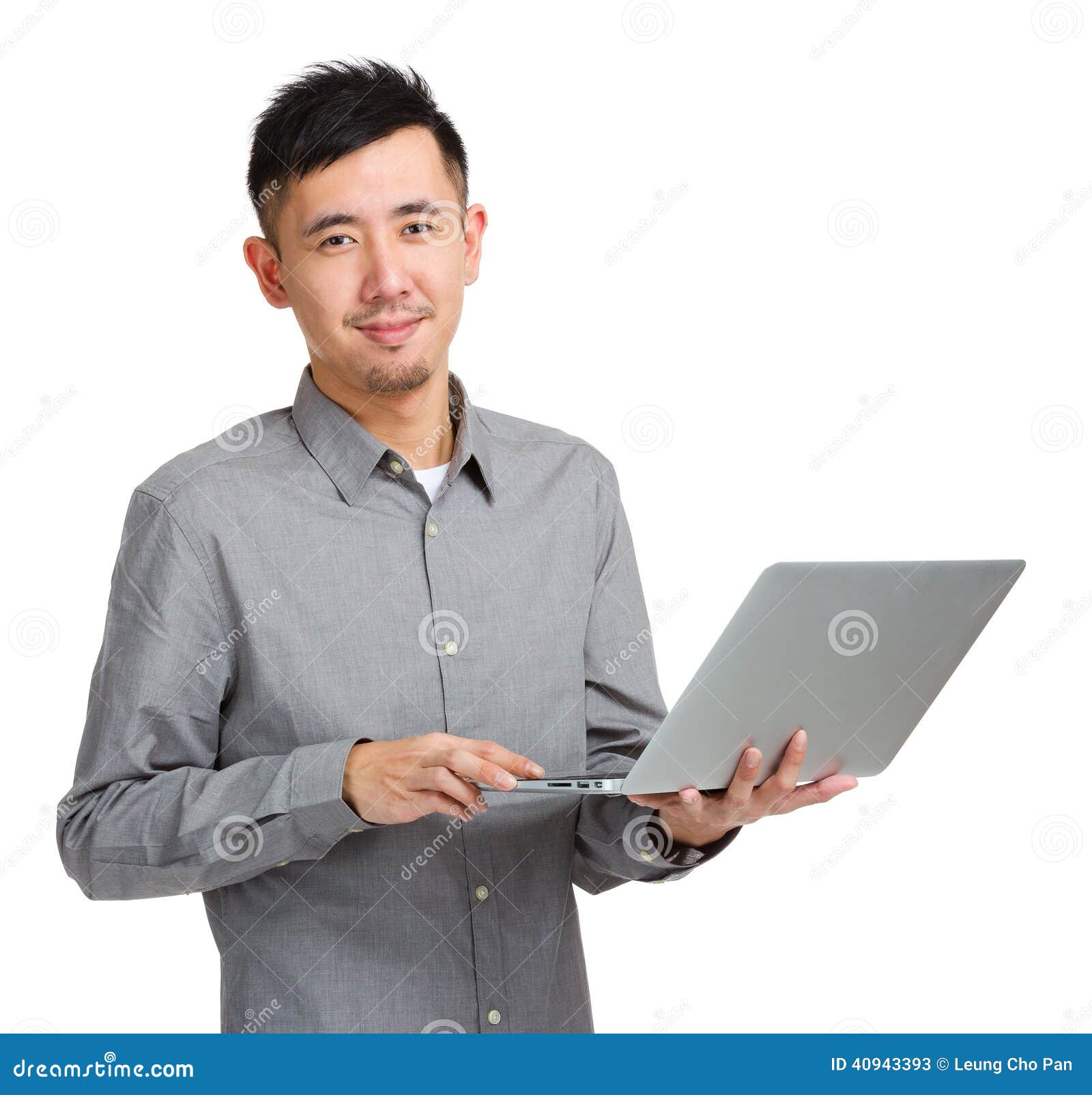 Young man holding laptop stock image. Image of malaysian - 40943393
