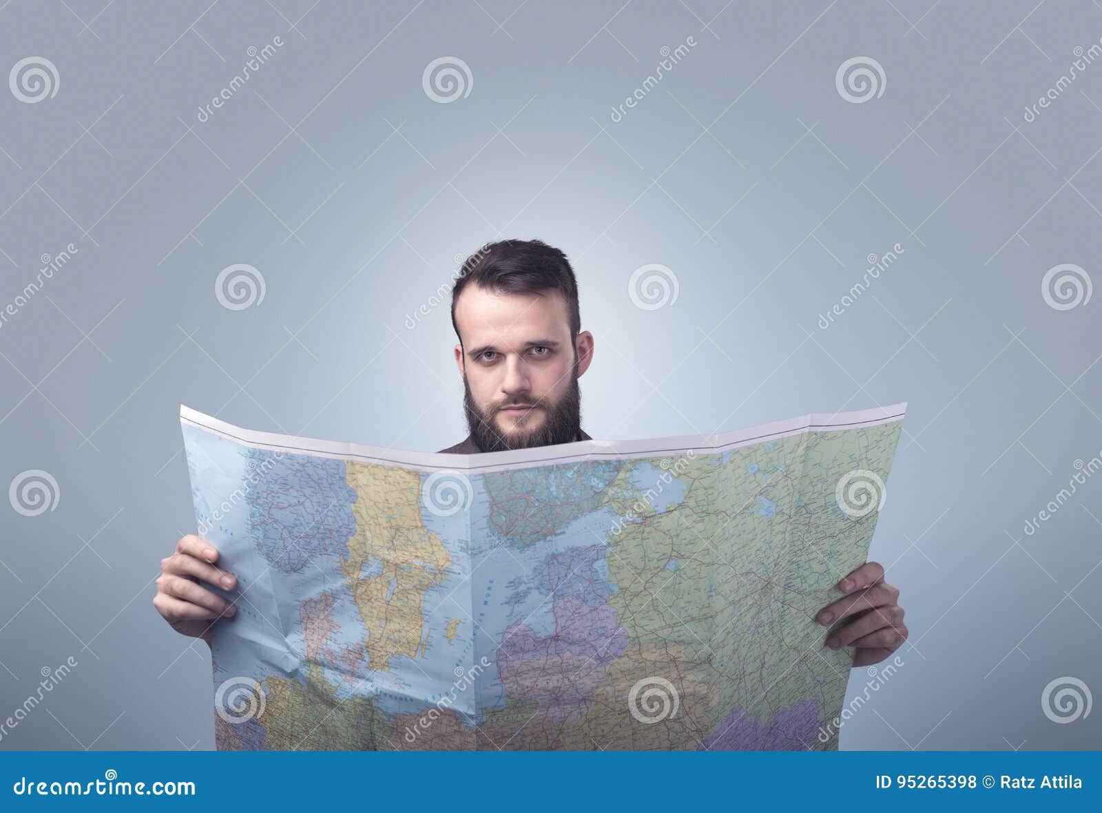 Young man holding map stock photo. Image of recreation - 95265398