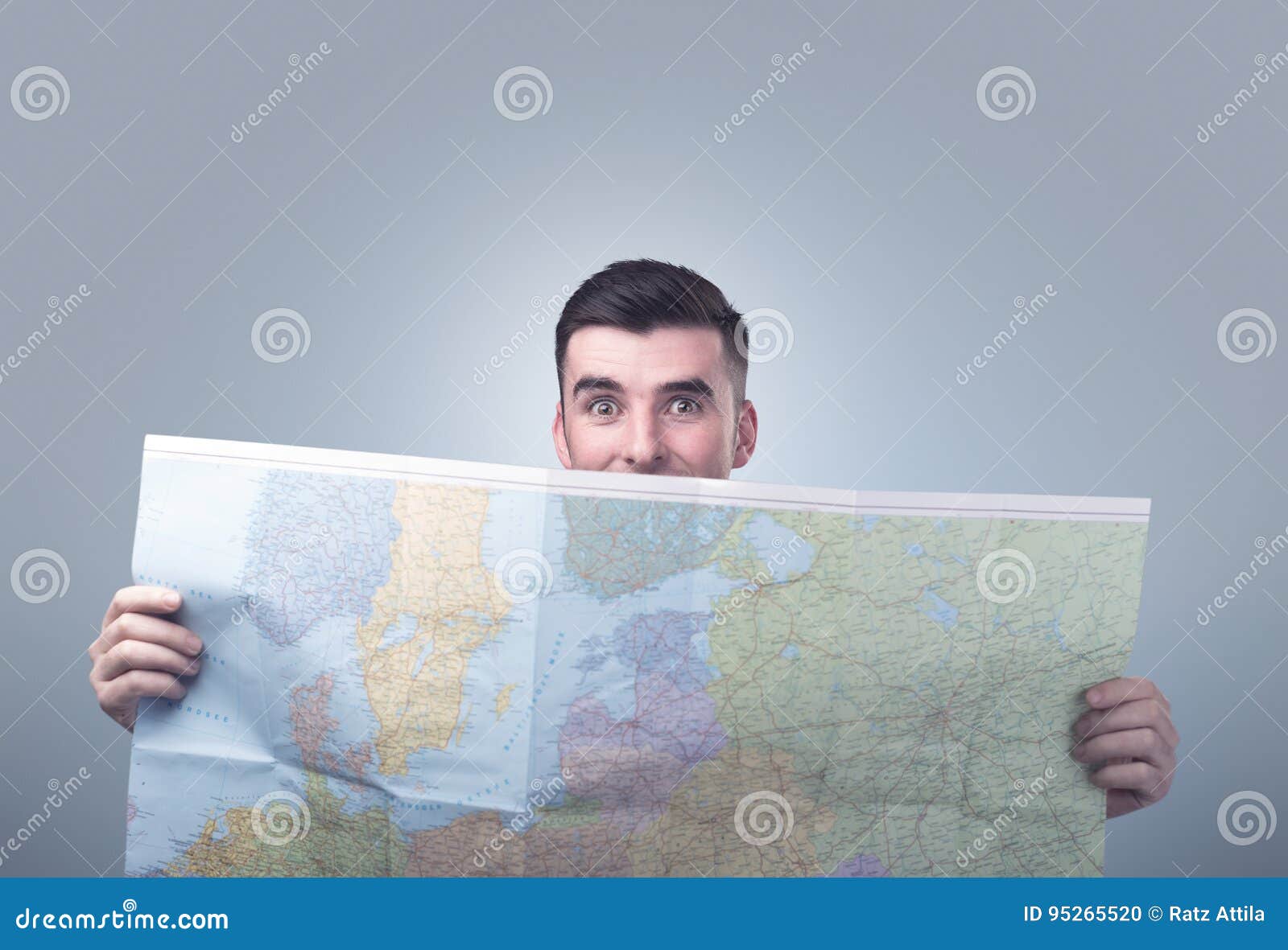 Young man holding map stock photo. Image of adventure - 95265520