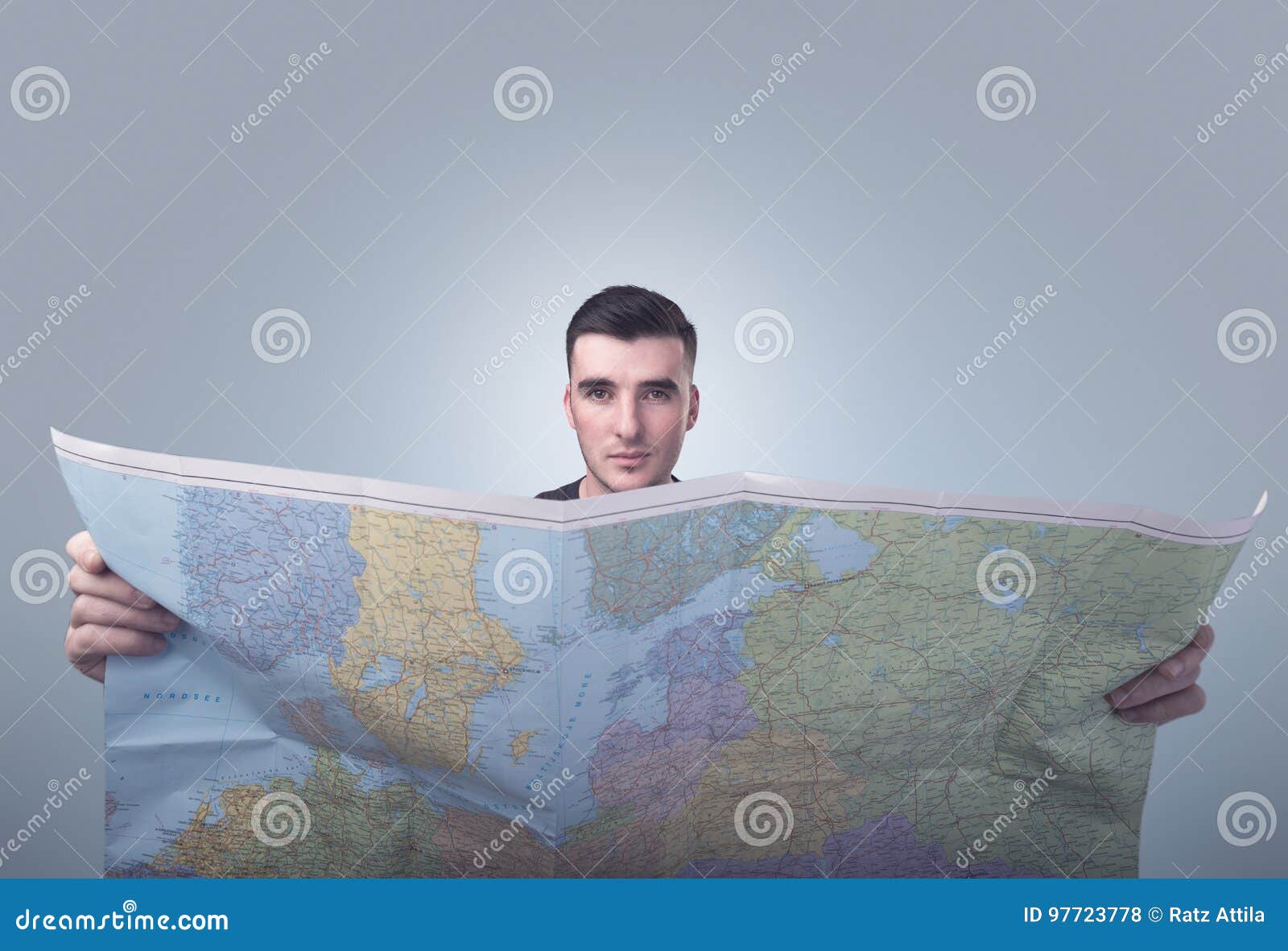Young man holding map stock photo. Image of hiking, destination - 97723778