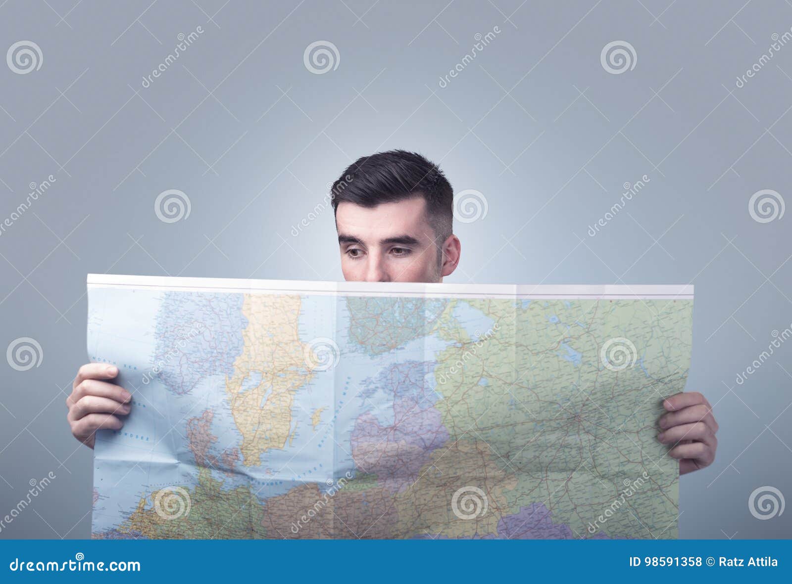 Young man holding map stock photo. Image of leisure, navigation - 98591358