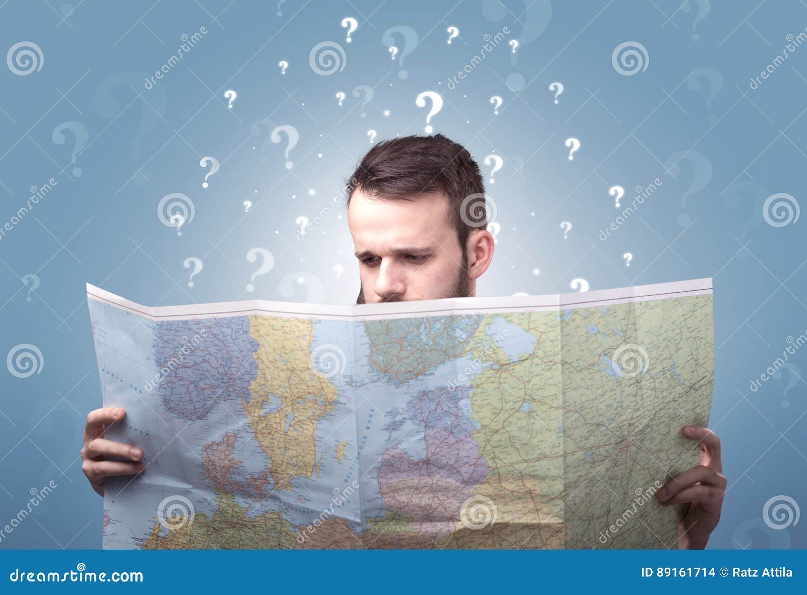 Young man holding map stock photo. Image of interest - 89161714