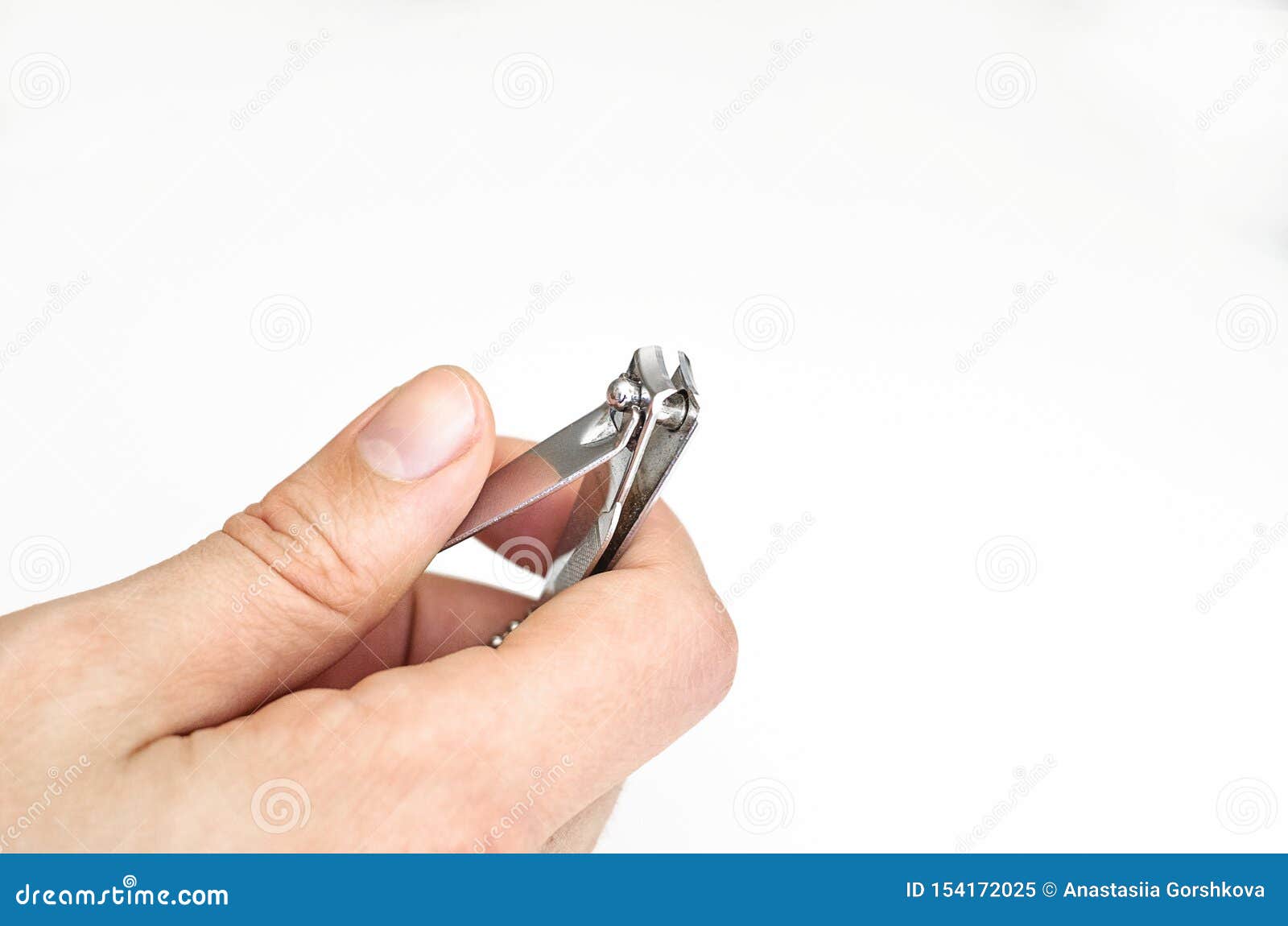 Young Man Holding A Nail Clipper Tool Stock Image Image Of Clipper