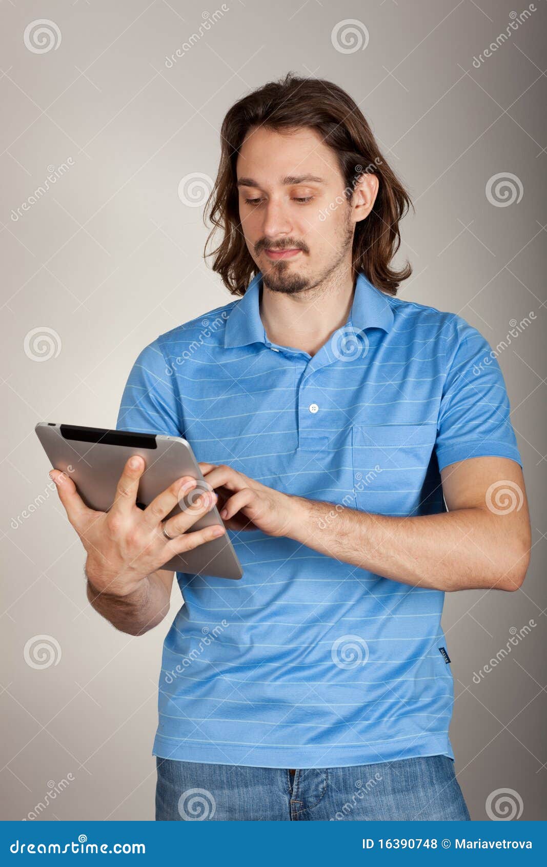 Young man holding notebook stock photo. Image of notebook - 16390748
