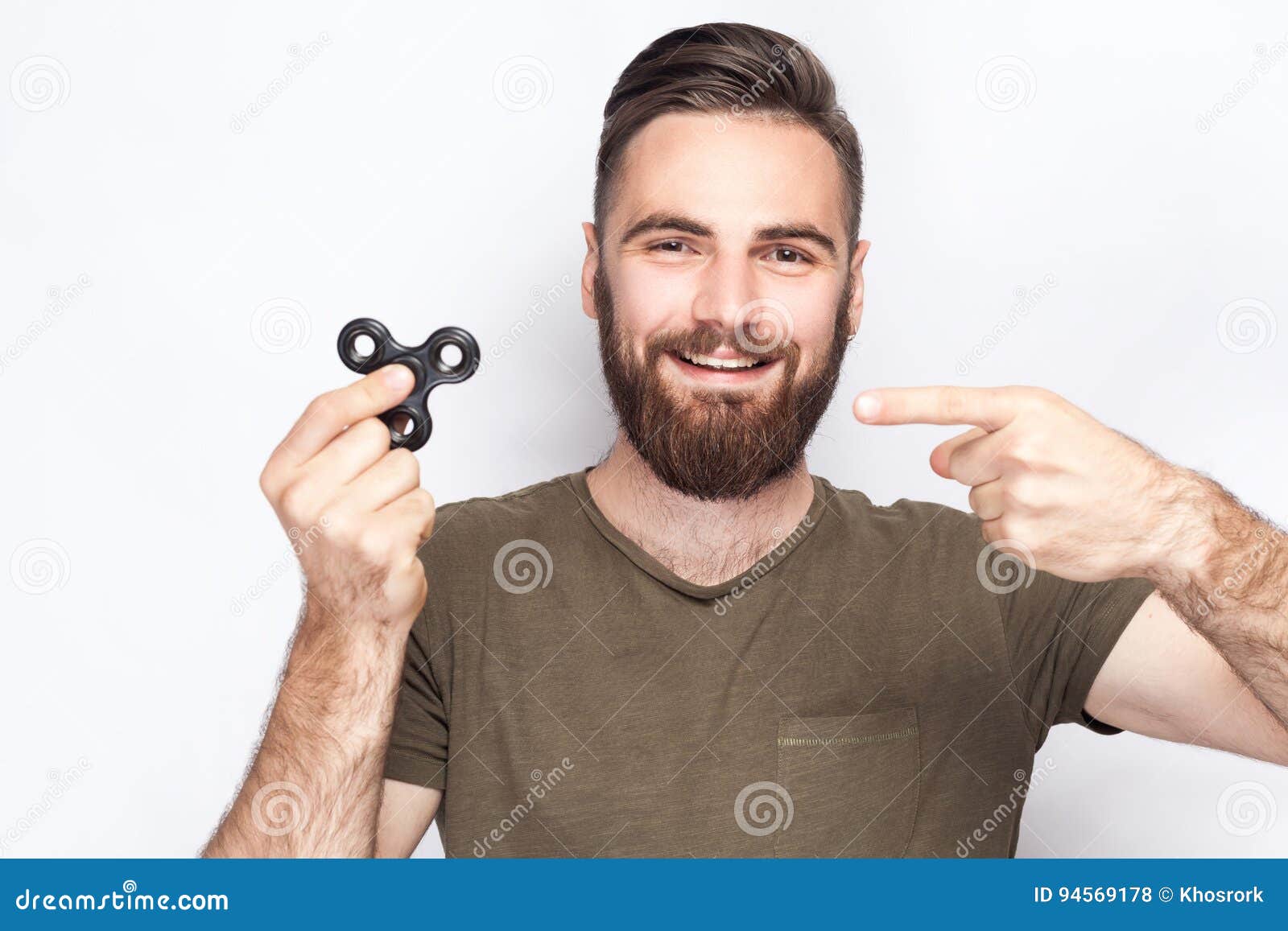 Young Man Holding and Playing with Fidget Spinner. Stock Photo - Image ...