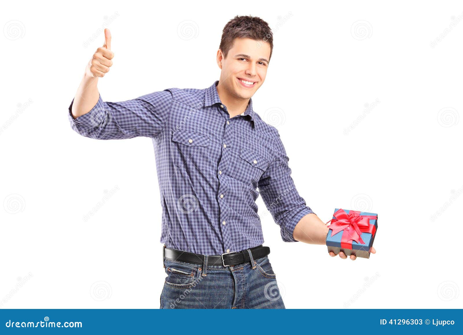 Young Man Holding a Present and Giving Thumb Up Stock Image - Image of ...