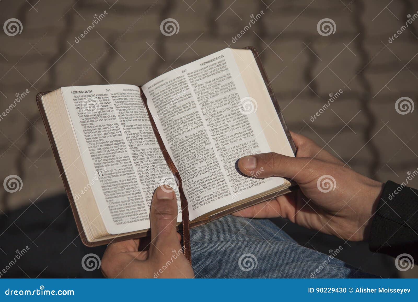 Young Man Holding and Reading Holy Bible Editorial Image - Image of ...