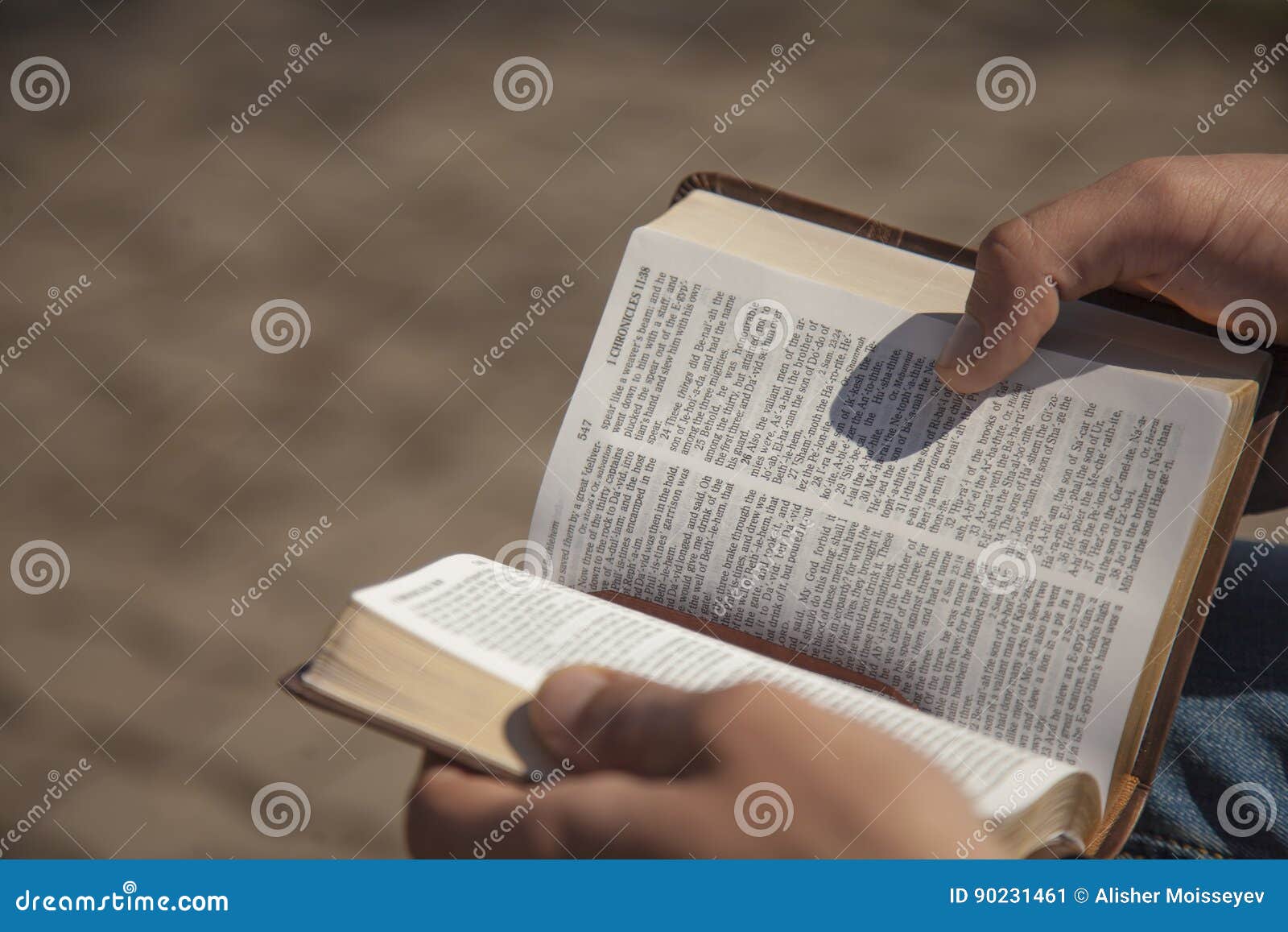 Young Man Holding and Reading Holy Bible Editorial Photo - Image of ...