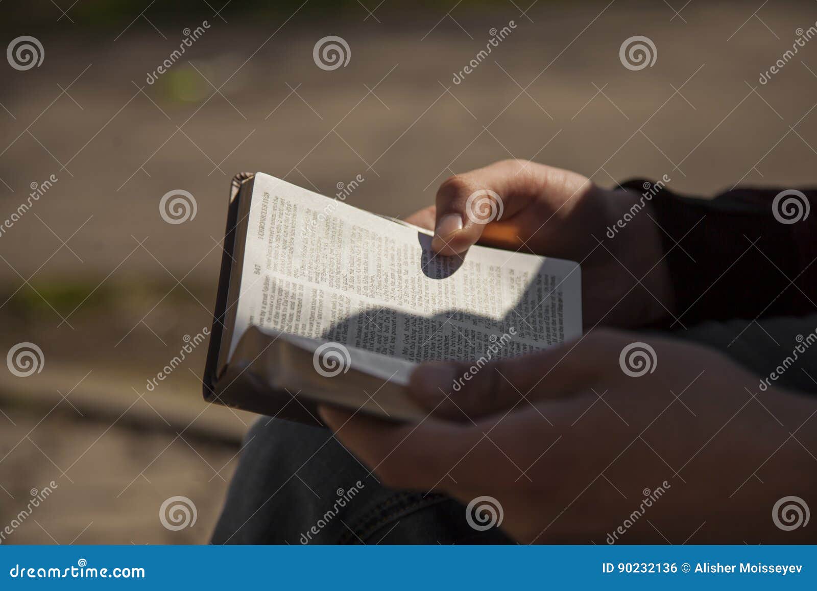 Young Man Holding and Reading Holy Bible Editorial Photo - Image of ...