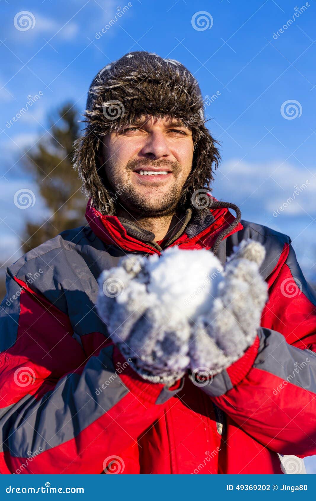 Young Man Holding a Snowball Stock Photo - Image of freezing, merry ...