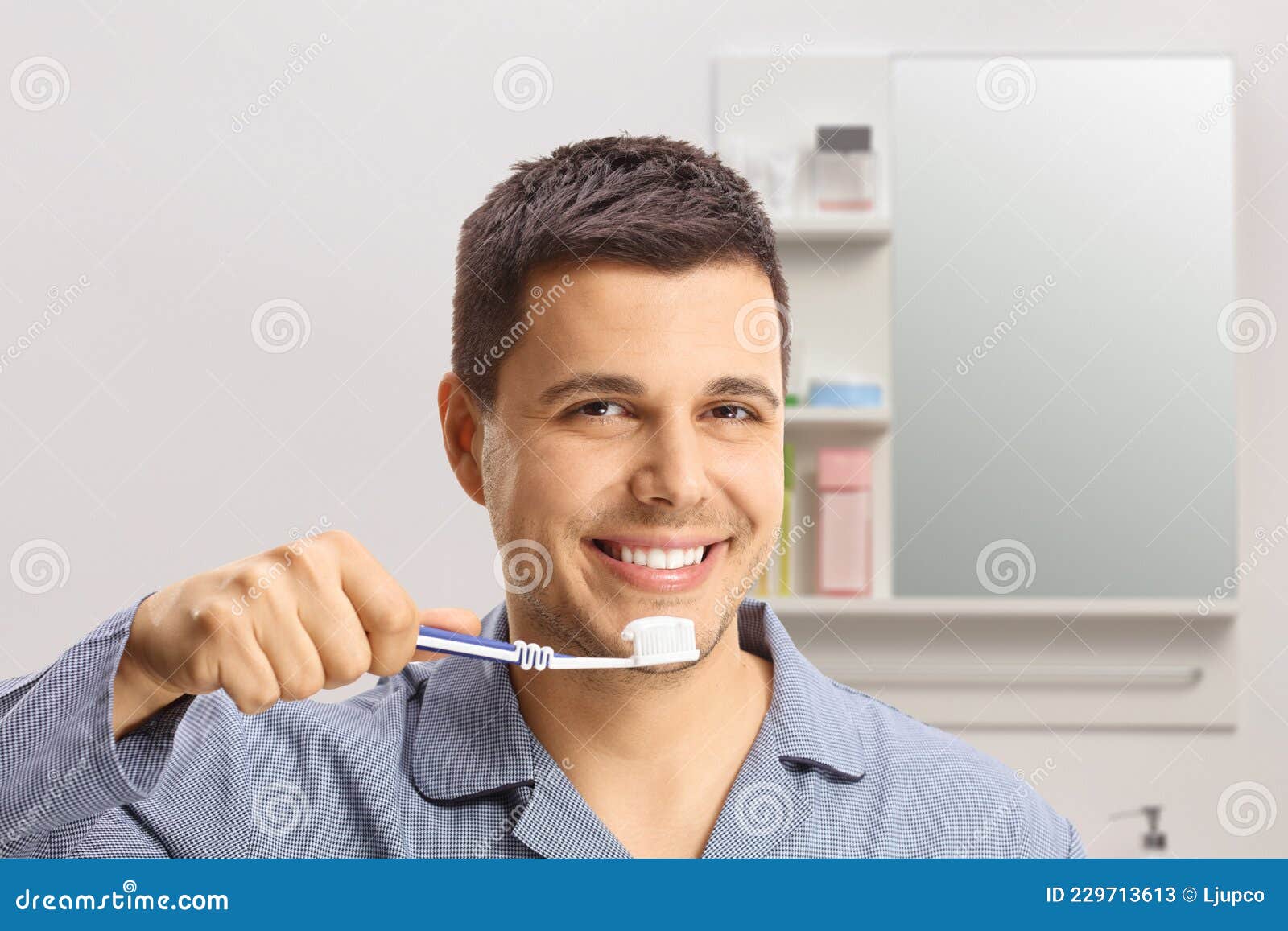 Young Man Holding a Toothbrush with Toothpaste Stock Image - Image of ...