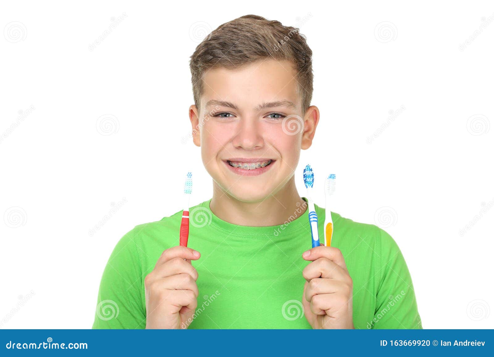 Young Man Holding Toothbrushes Stock Photo - Image of dentistry, people ...