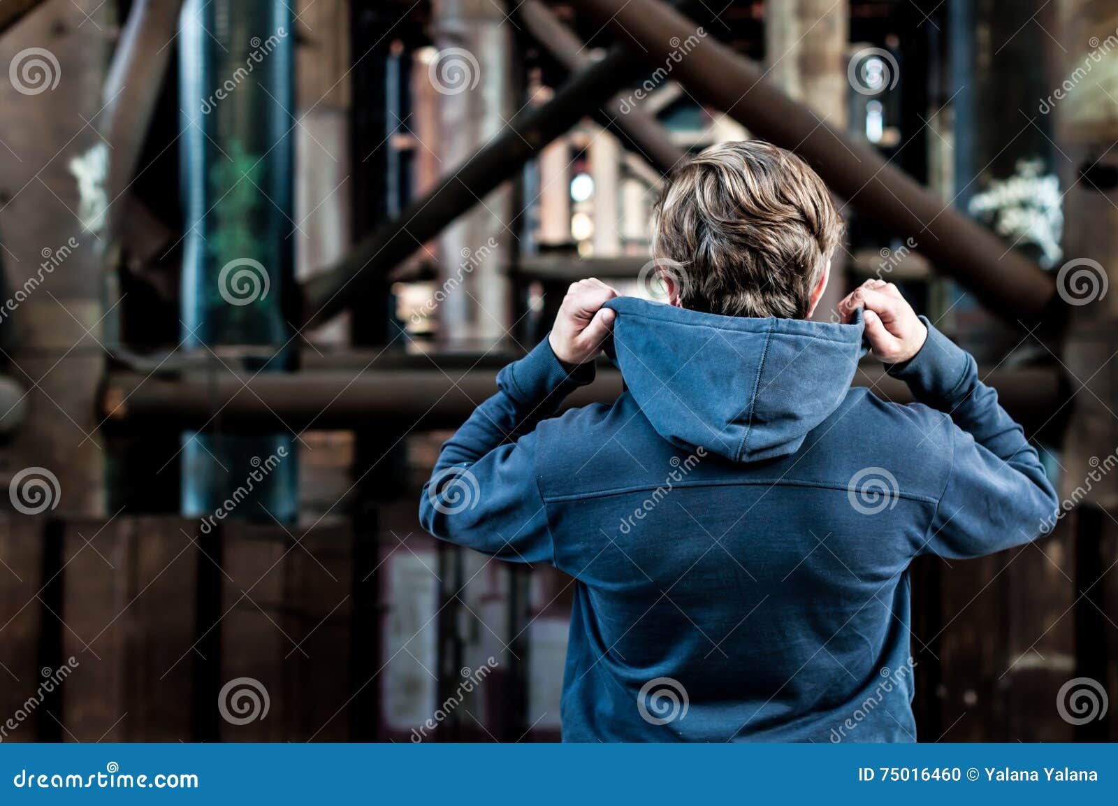 Young man holds hands hood stock photo. Image of hood - 75016460