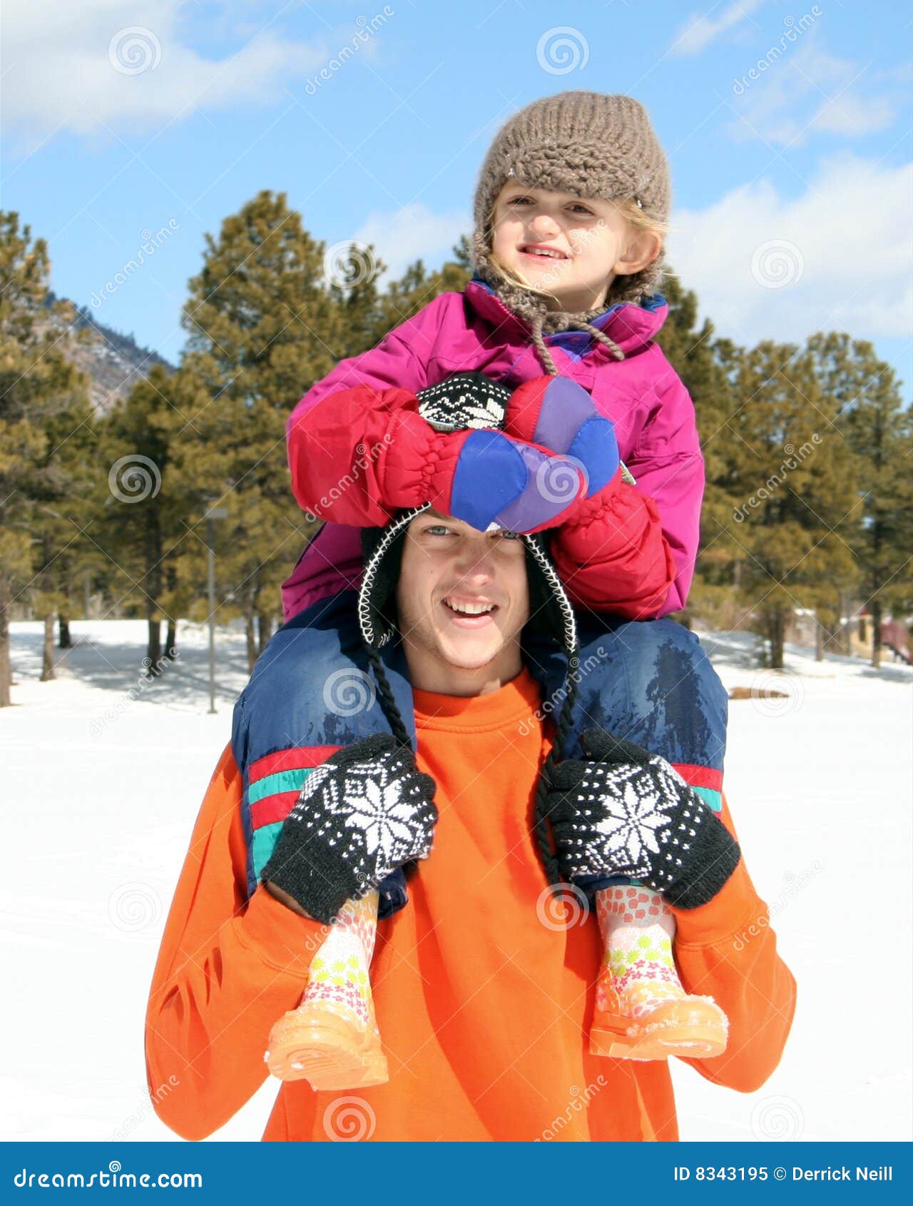 A Young Man Holds a Little Girl Stock Image - Image of jacket, carrying ...