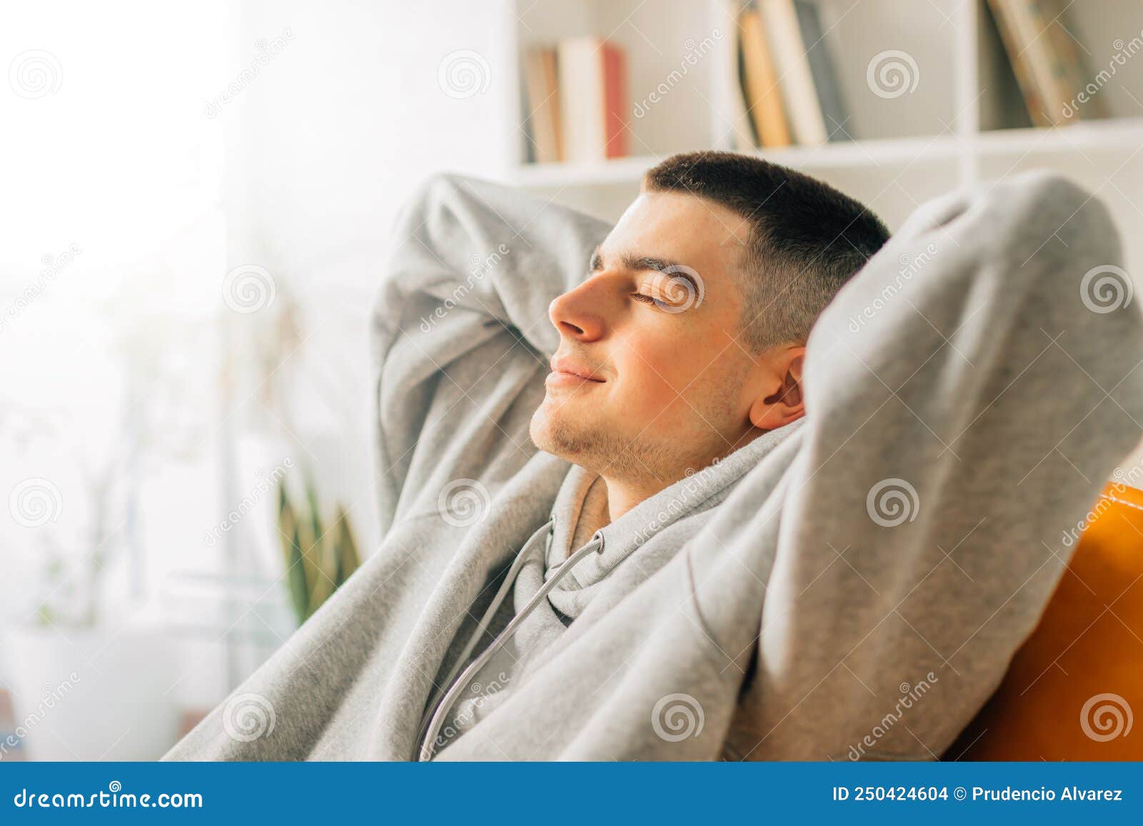 Young man at home resting stock photo. Image of meditate - 250424604