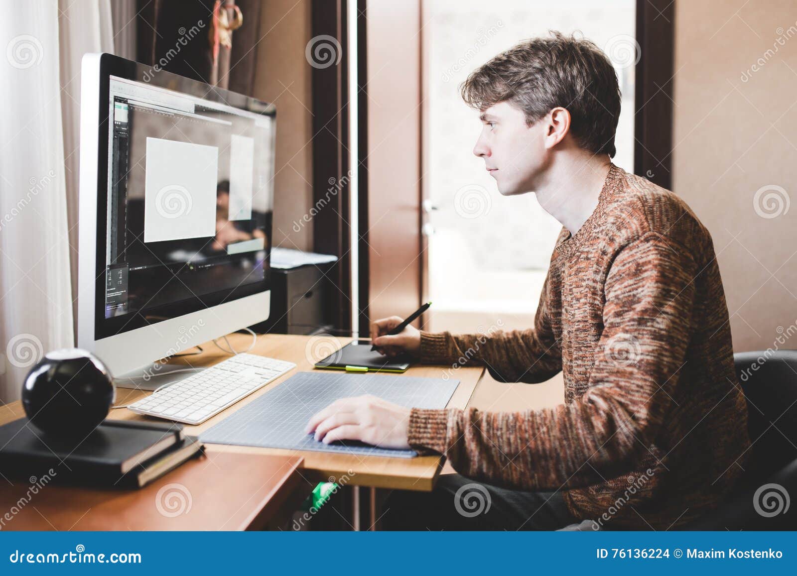 Young Man at Home Using a Computer, Freelance Developer or Designer ...