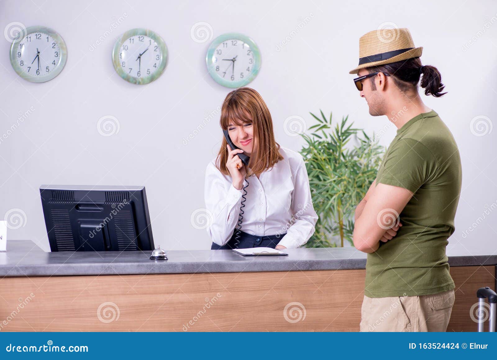 Young Man at the Hotel Reception Stock Photo - Image of desk, lounge ...