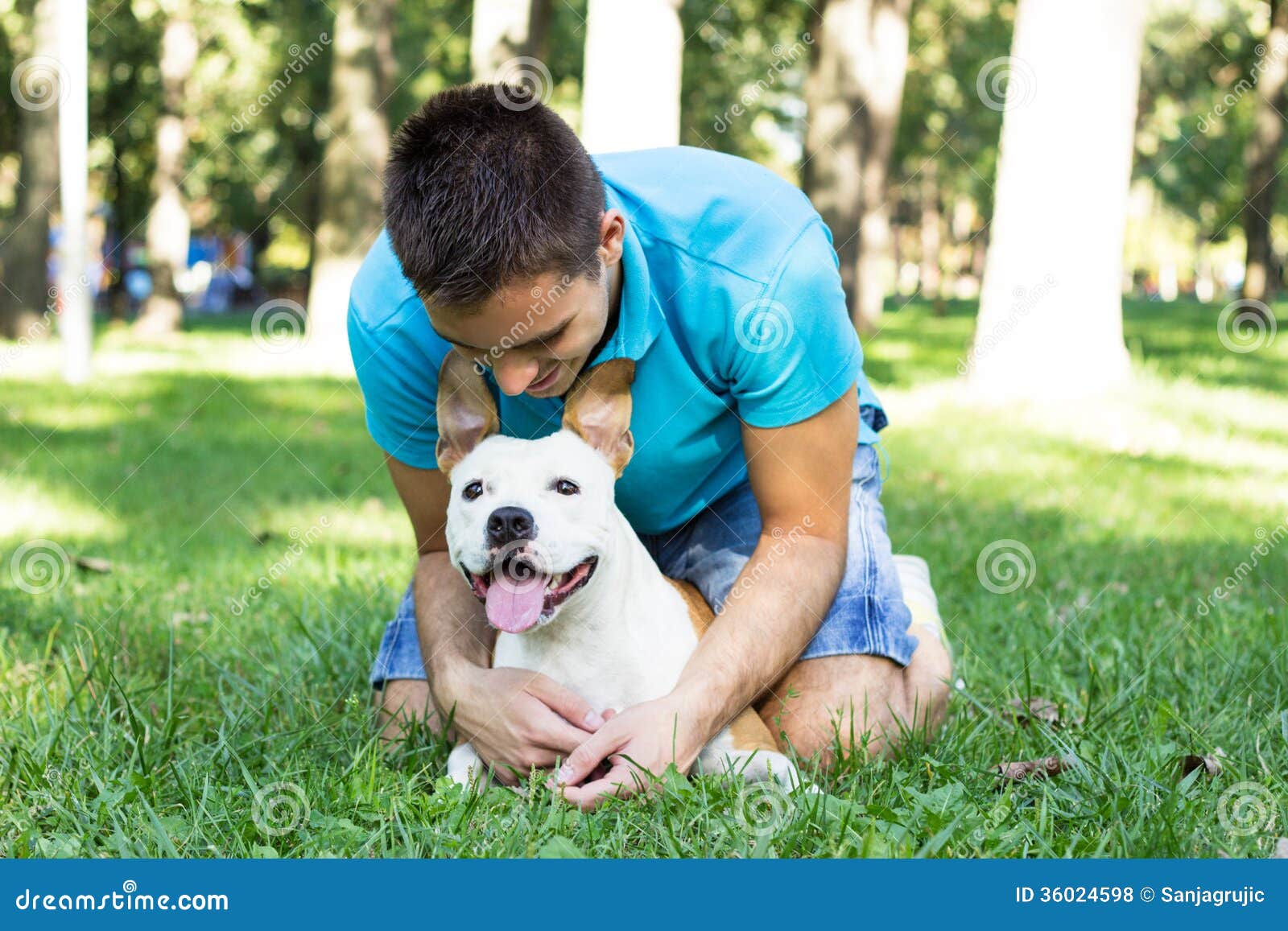 Young man hugging his dog stock photo. Image of american - 36024598