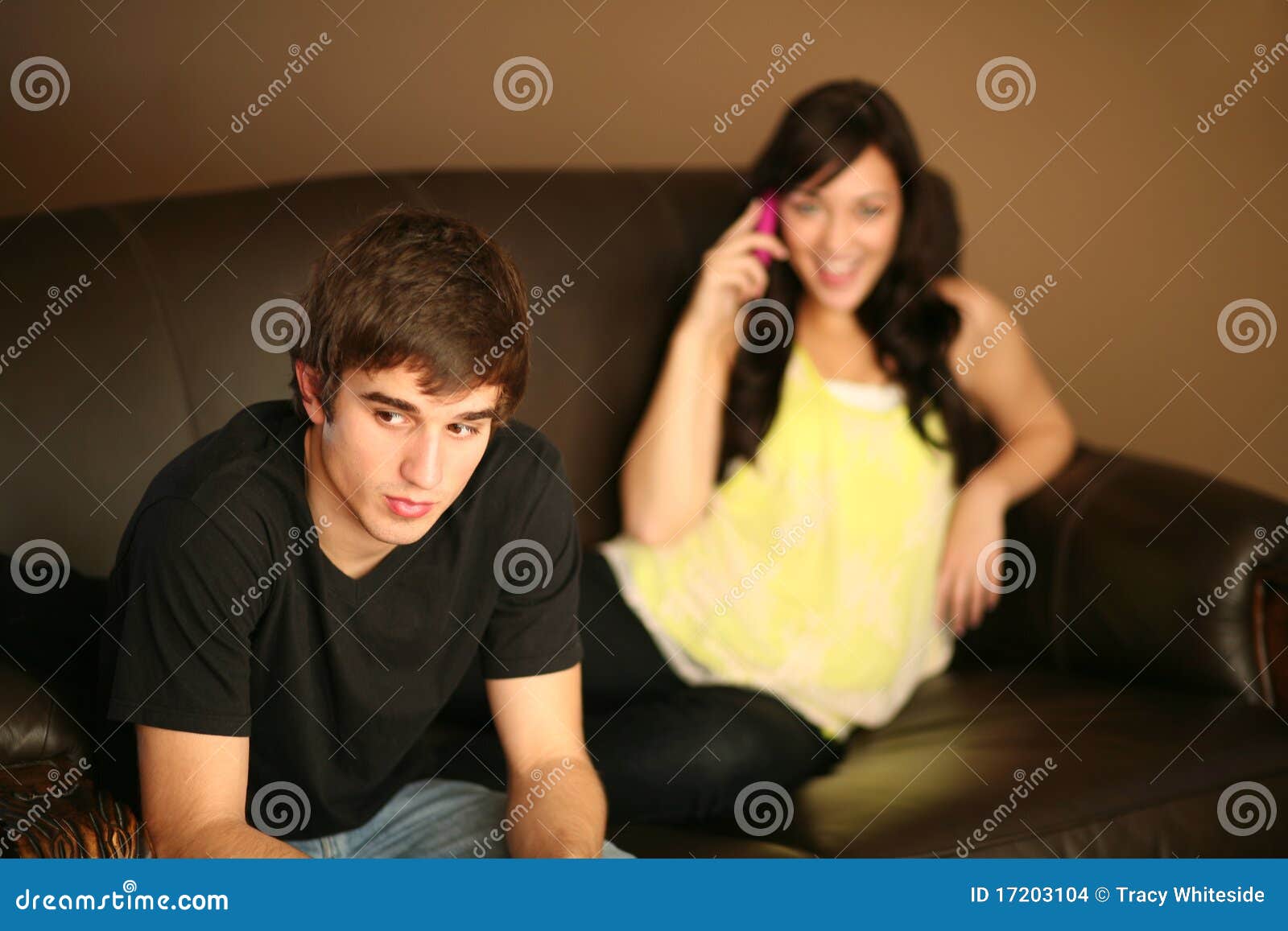 Young Man Ignored by Girlfriend on Phone Stock Photo - Image of ...