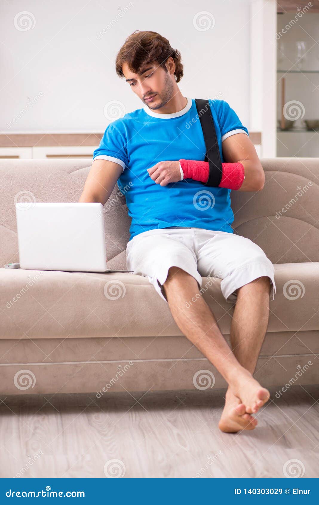 The Young Man with Injured Arm Sitting on the Sofa Stock Image - Image ...