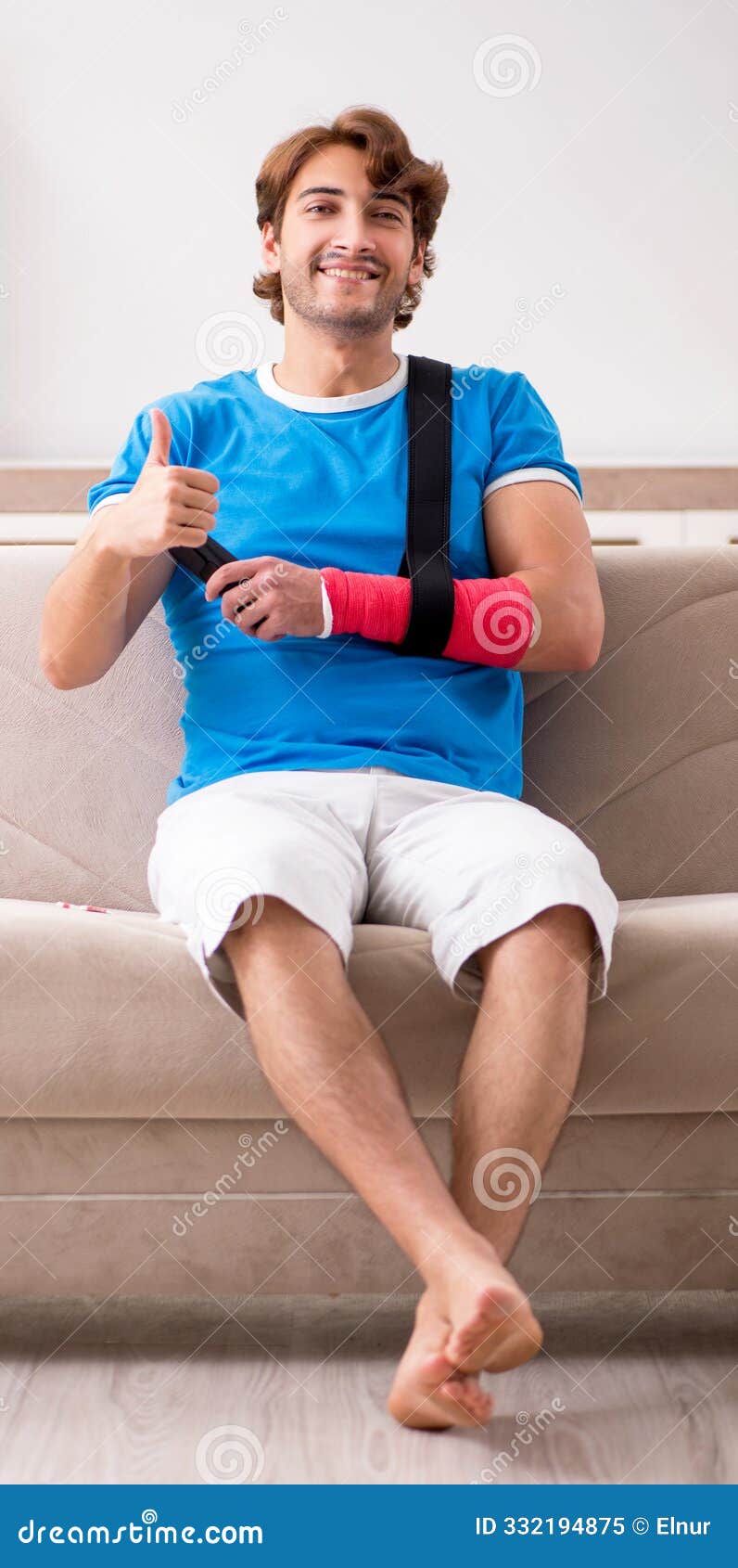 Young Man with Injured Arm Sitting on the Sofa Stock Image - Image of ...