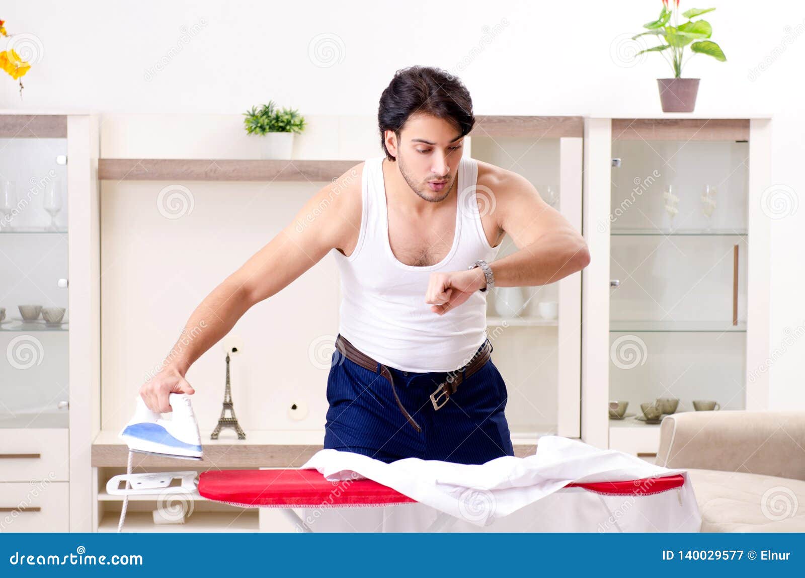 The Young Man Ironing in the Bedroom Stock Image - Image of housewife ...